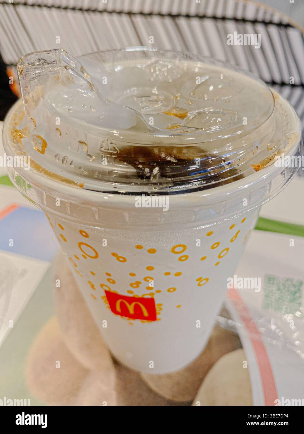 A strawless McDonalds soda drink container cup. Scenes from around ...