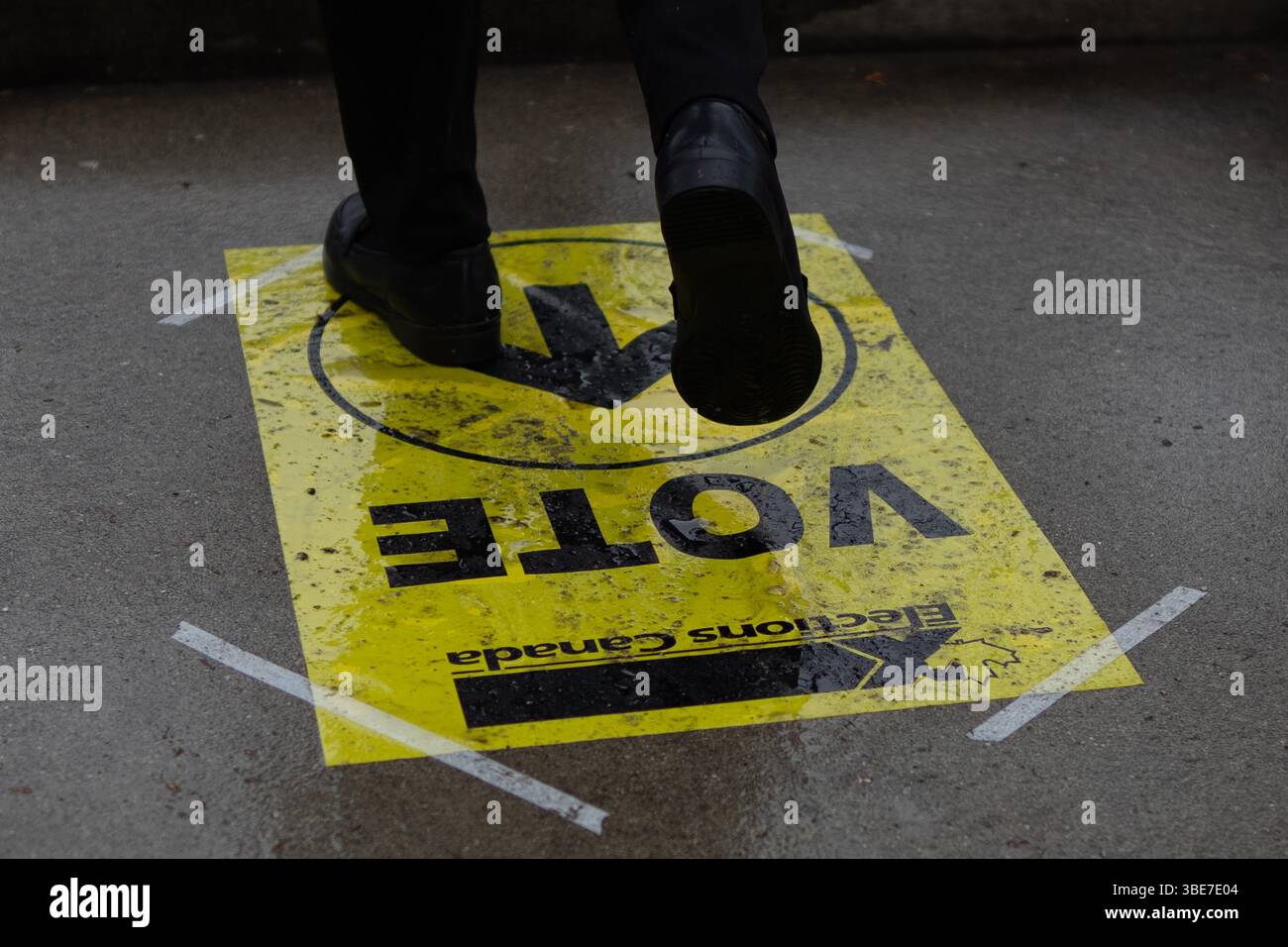 Vancouver, Canada. 28th Apr, 2025. A person leaves after voting at a ...