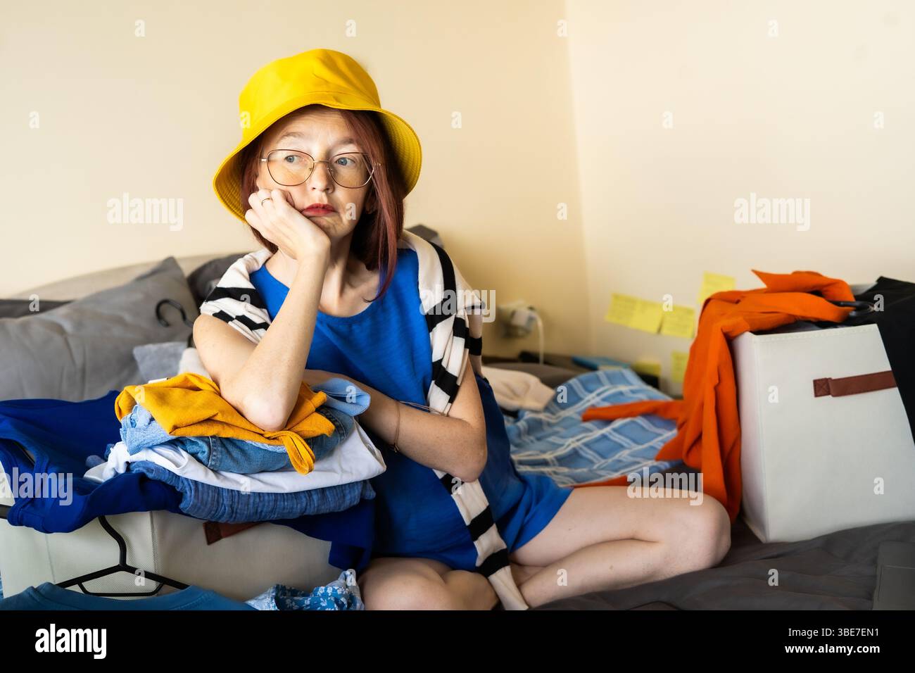 Woman overwhelmed in closet hi-res stock photography and images - Alamy