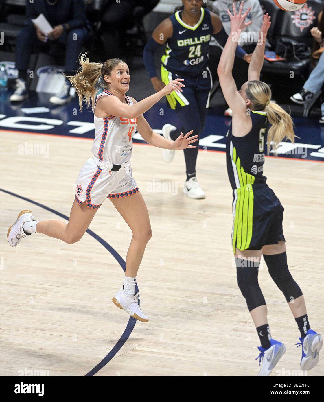 Connecticut Sun's Jacy Sheldon (4) throws a pass past Dallas Wing's ...