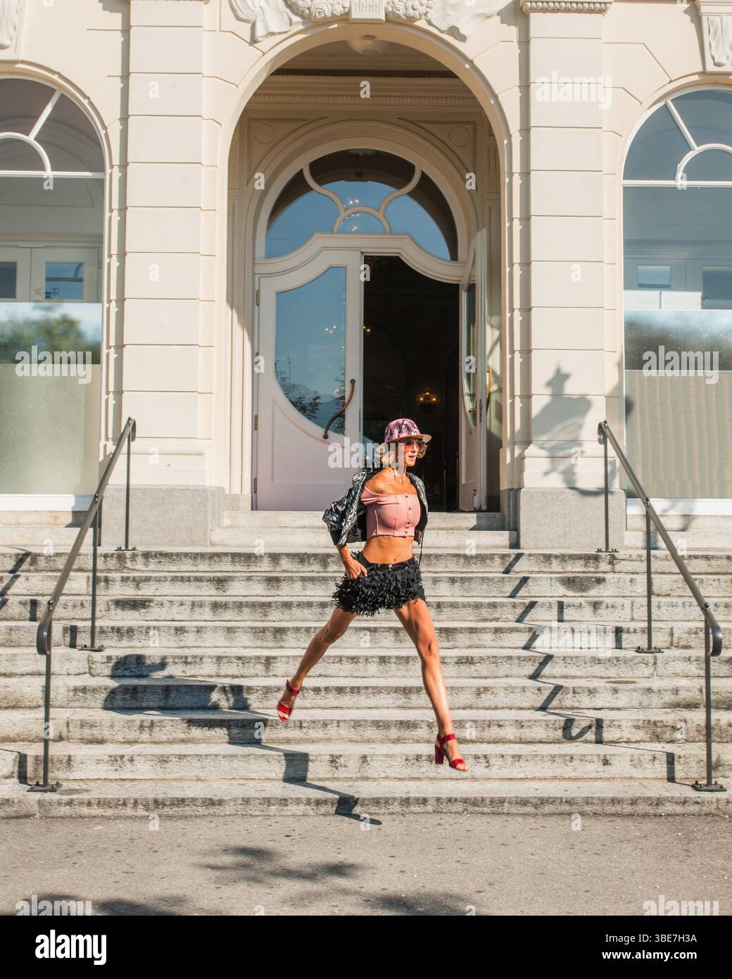 Model running down stairs hi-res stock photography and images - Alamy