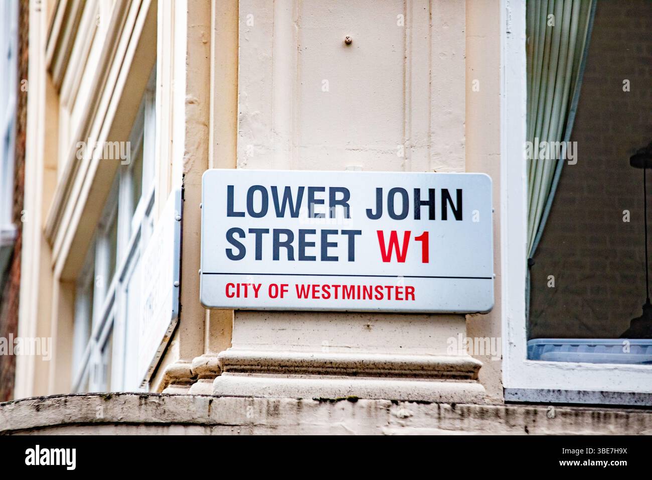 Street sign of Lower John Street located in the City of Westminster ...