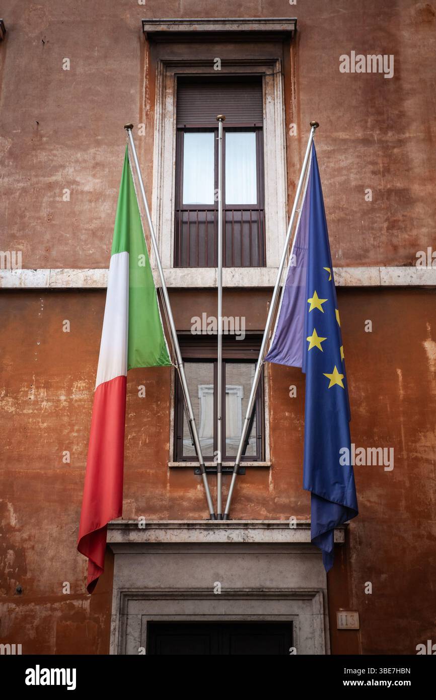 Italian flag and European Union flag hang in a V-shaped arrangement ...