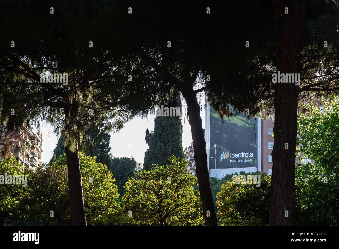 VALENCIA, SPAIN - APRIL 15, 2025: The Iberdrola logo and slogan "Por ti. Por el planeta" on a ...