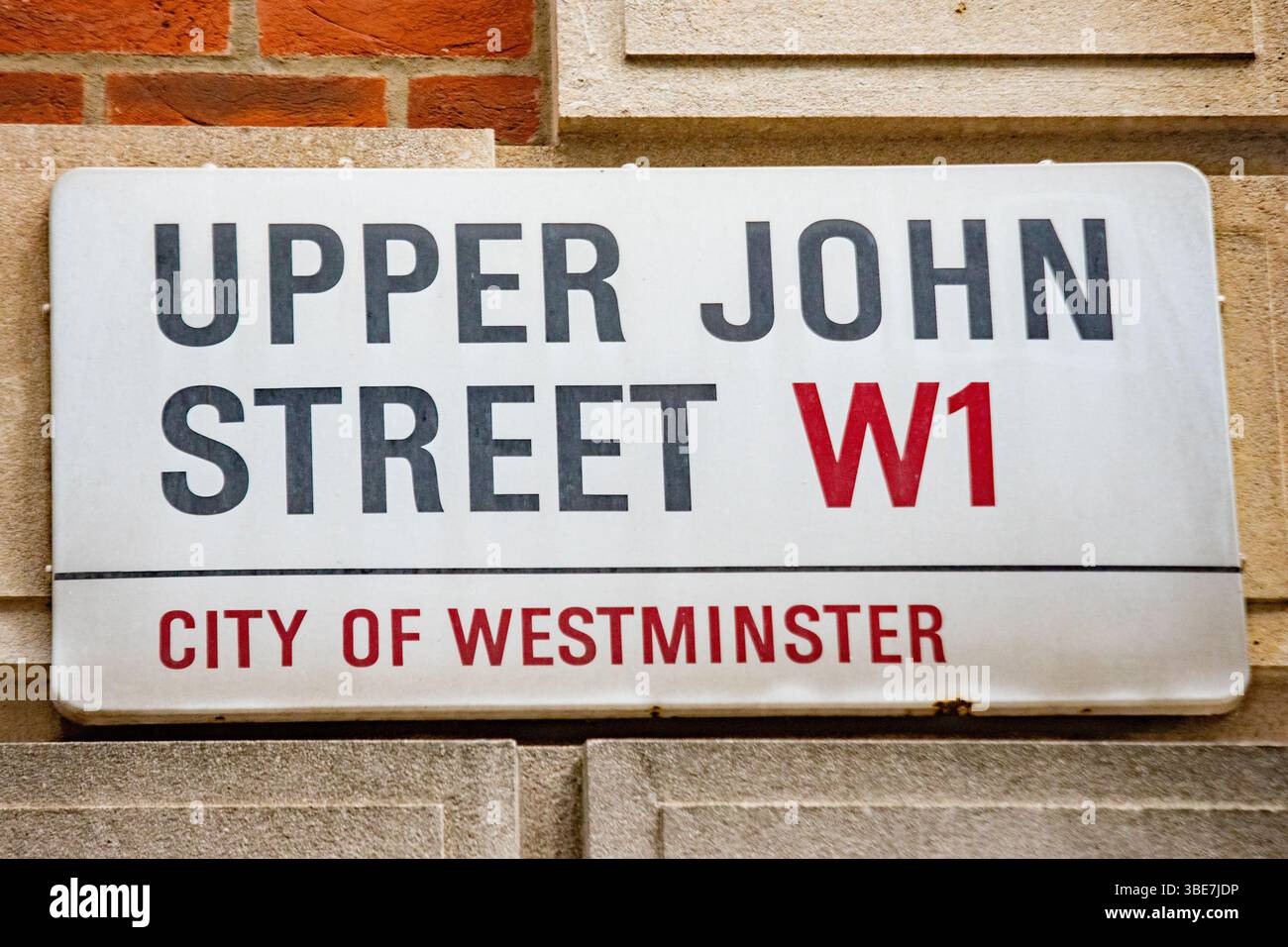 Street sign for Upper John Street in Westminster, London. The sign ...
