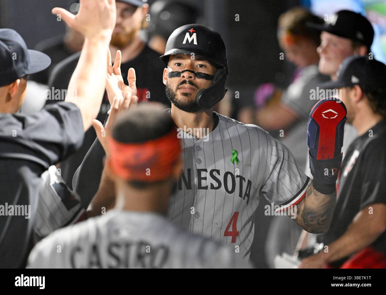 Minnesota Twins' Carlos Correa (4) celebrates after scoring on a Ty ...