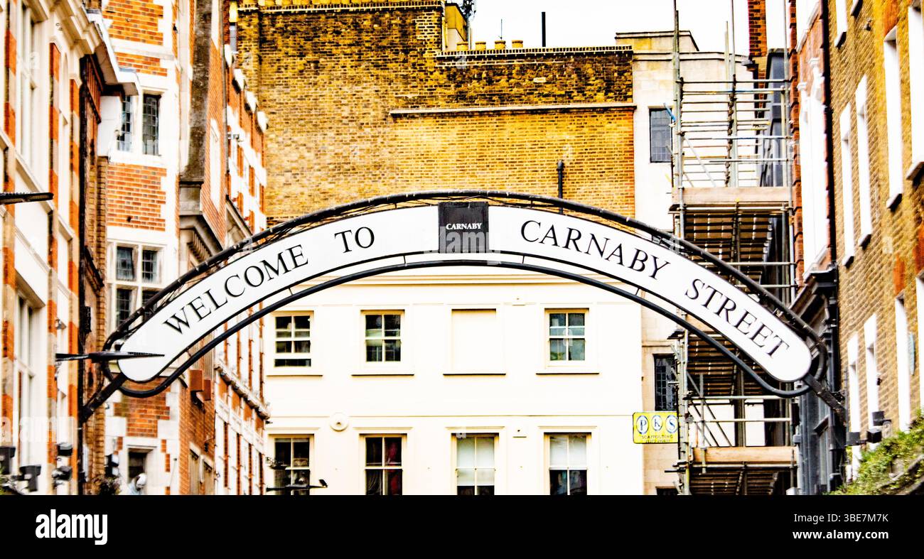 The iconic sign welcomes visitors to Carnaby Street in London, a famous ...
