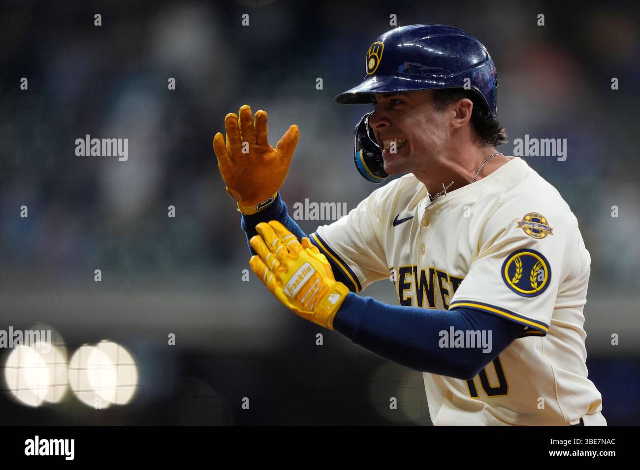 Milwaukee Brewers' Sal Frelick reacts after hitting an RBI single ...