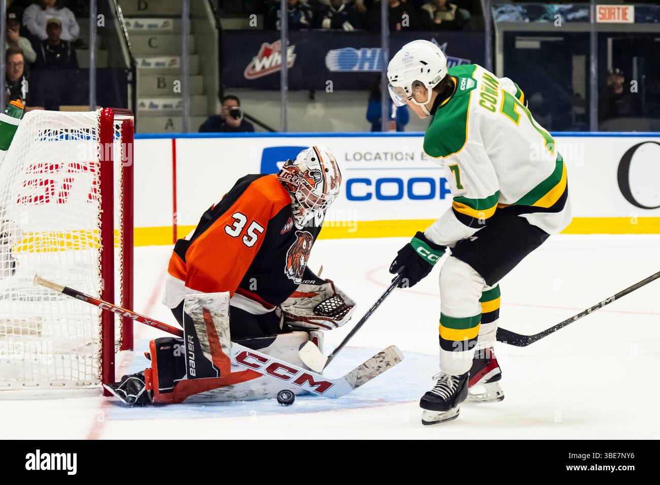 Medicine Hat Tigers goaltender Harrison Meneghin (35) makes a save on ...