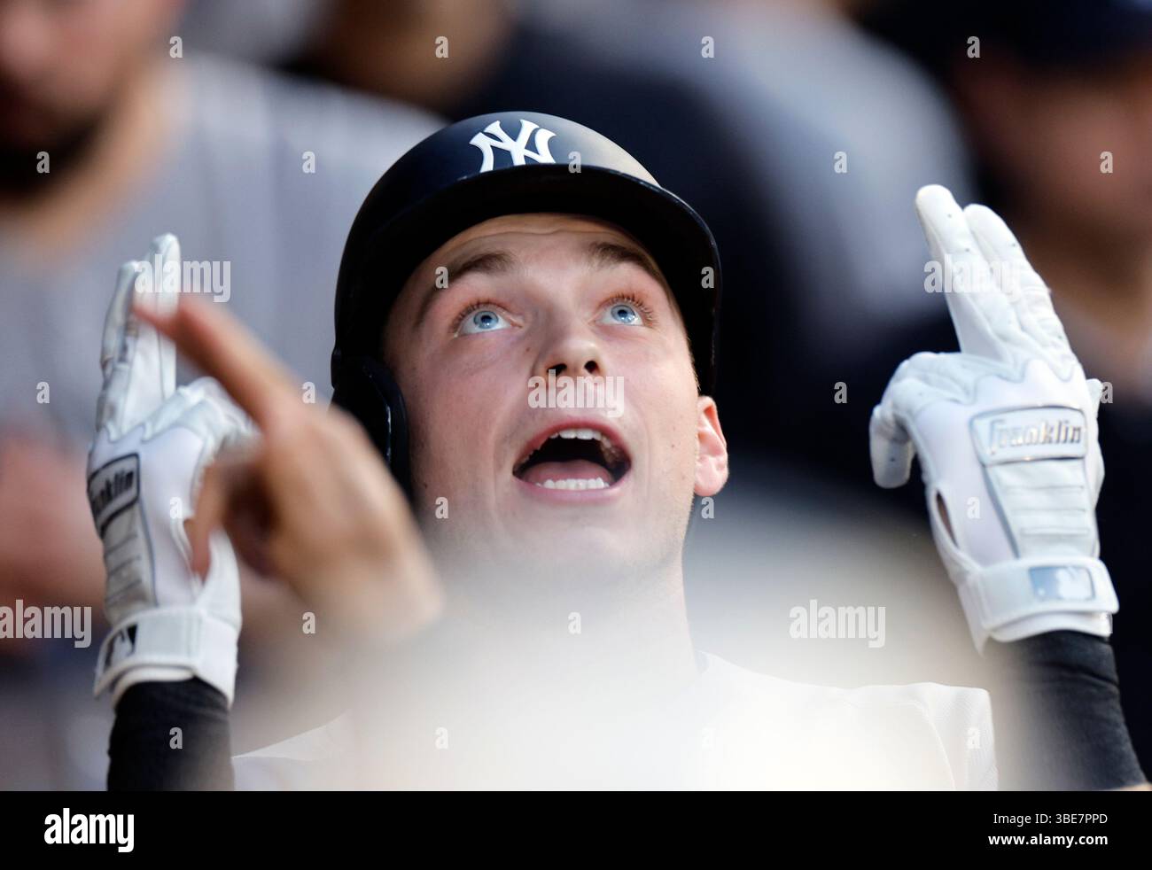 New York Yankees' Ben Rice celebrates in the dugout after hitting one ...