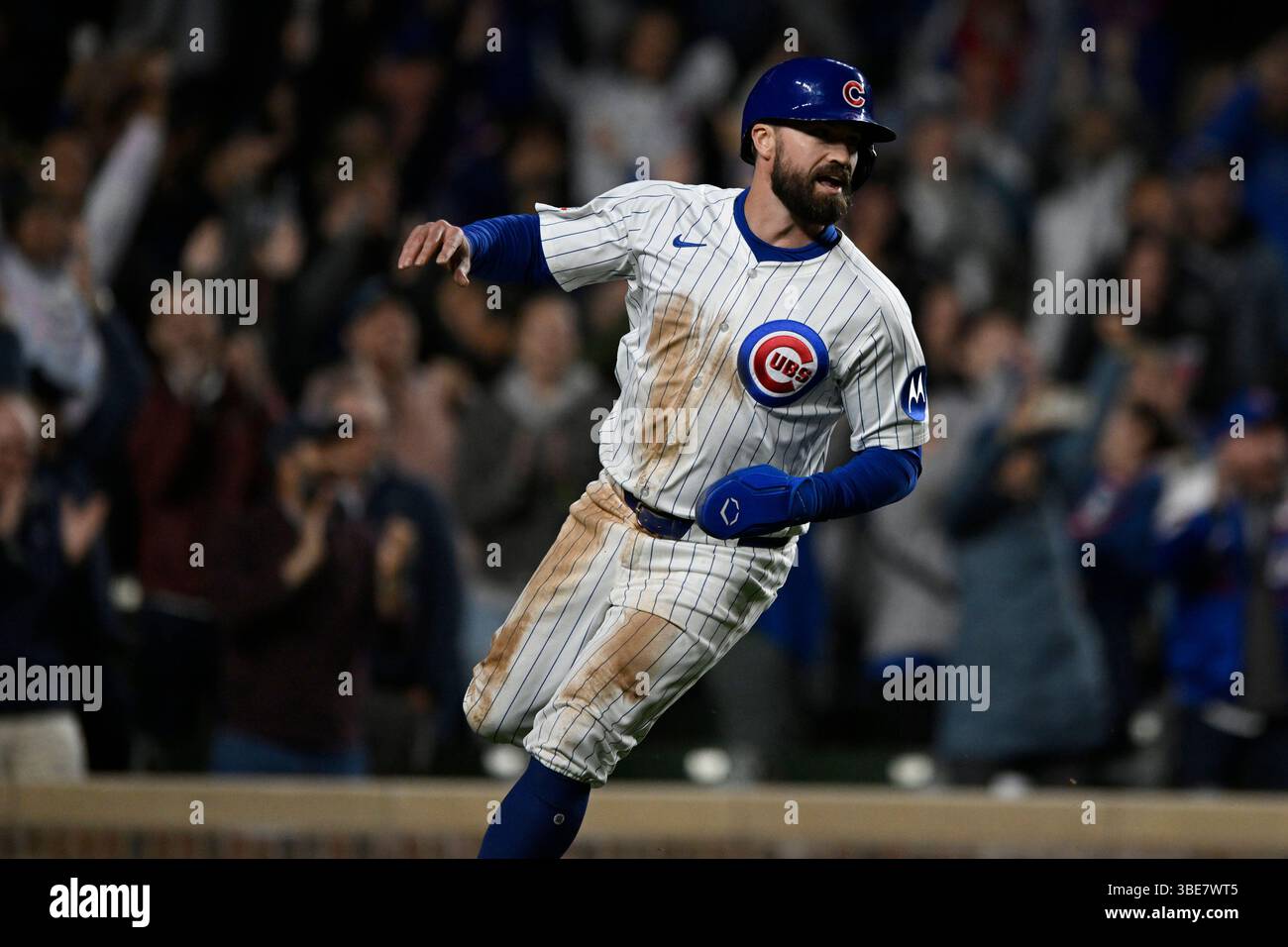 Chicago Cubs' Jon Berti celebrates after scoring the winning run on a ...