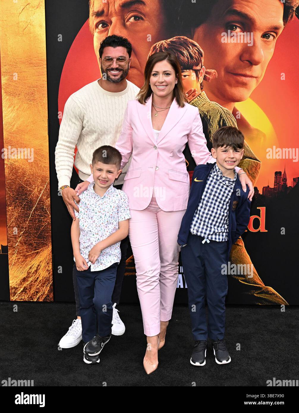 Brian Mazza, left, and Chloe Melas pose with their children at the ...