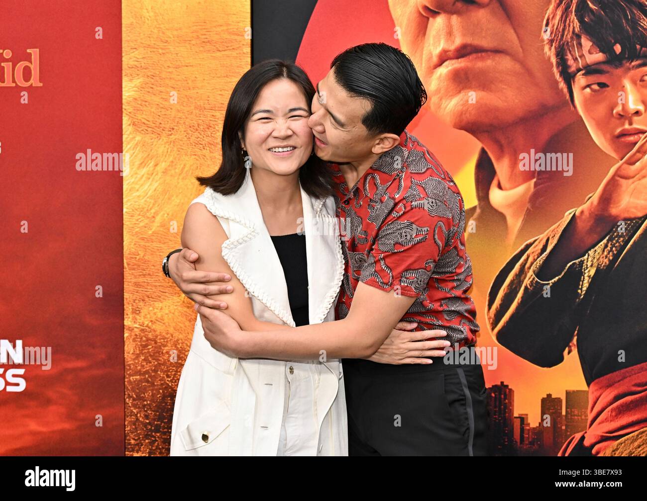 Hannah Pham, left, and Ronny Chieng attend the world premiere of "Karate Kid: Legends" at the ...