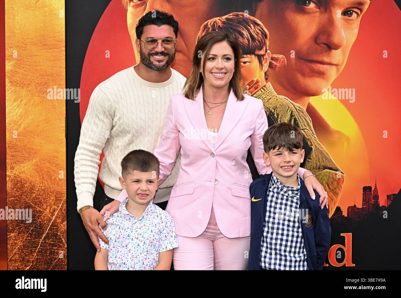 Brian Mazza, left, and Chloe Melas pose with their children at the ...