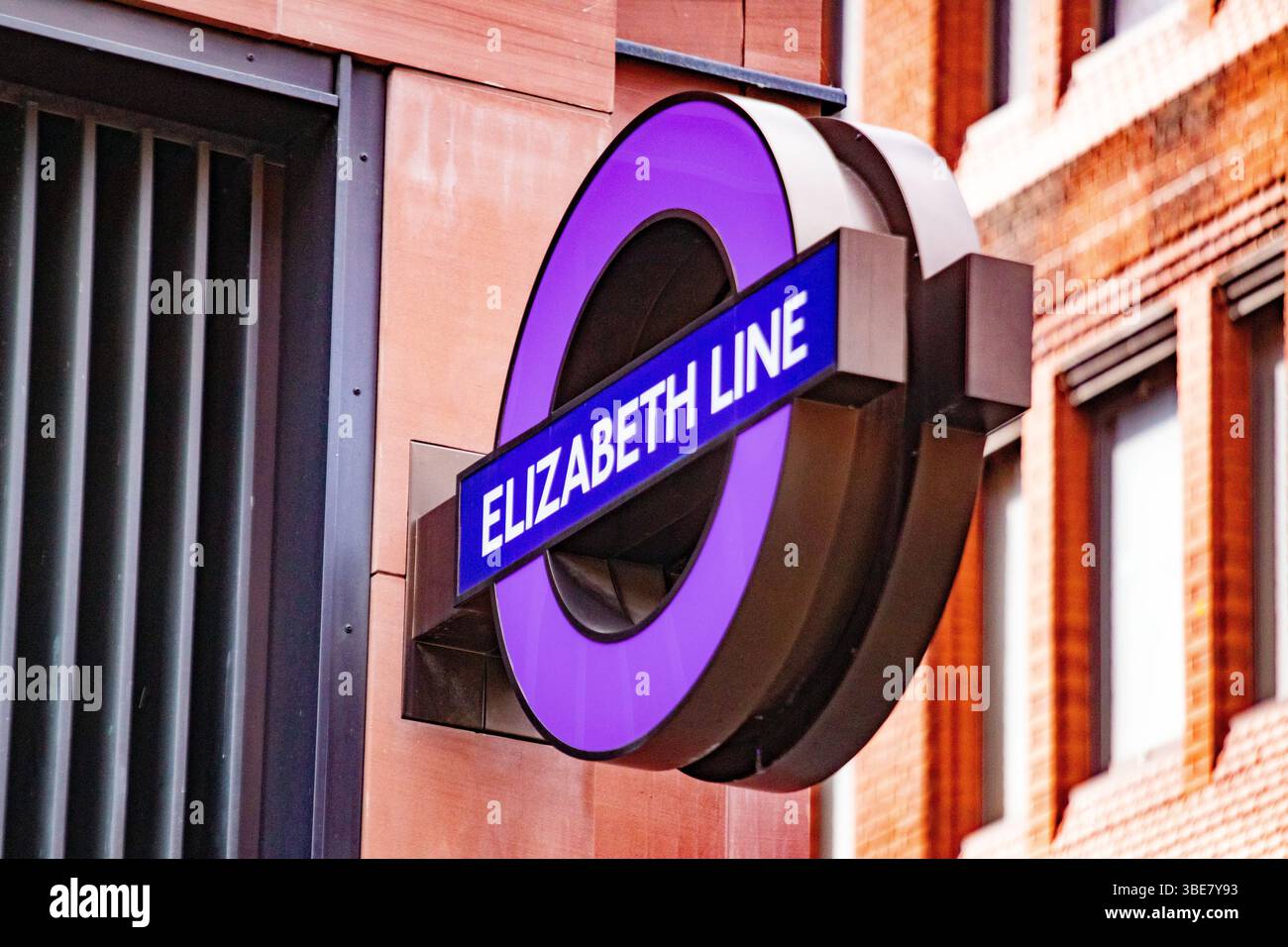 Close-up of the Elizabeth Line sign on a building facade in London. The ...