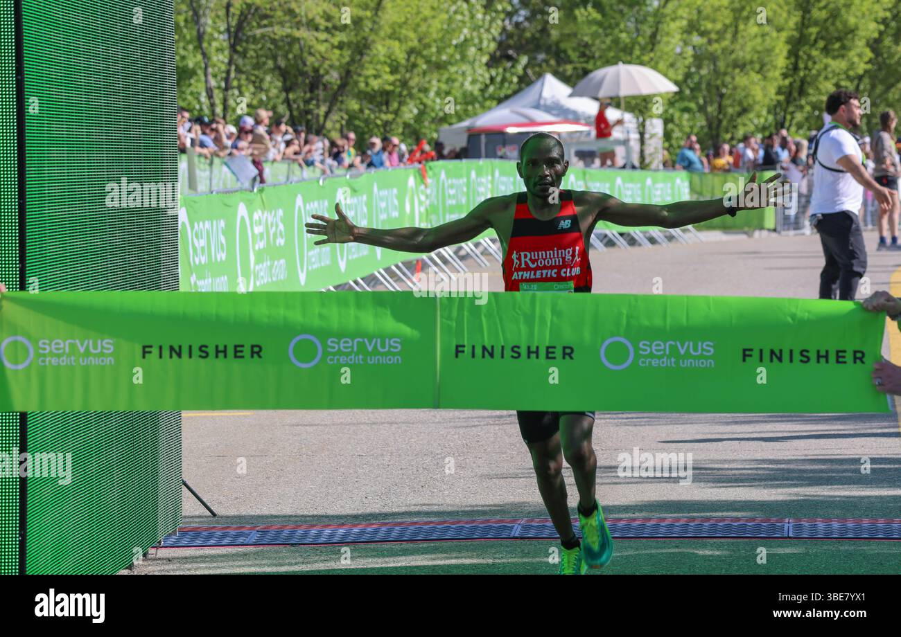 Calgary, Canada. 25th May, 2025. A Canadian participant wins the 24 Km ...