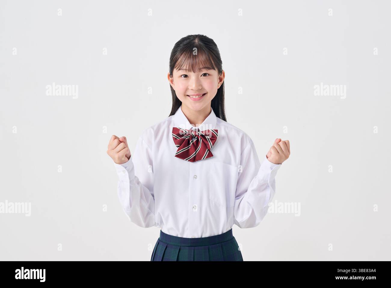 Japanese junior high school girl posing for a fight on white background ...