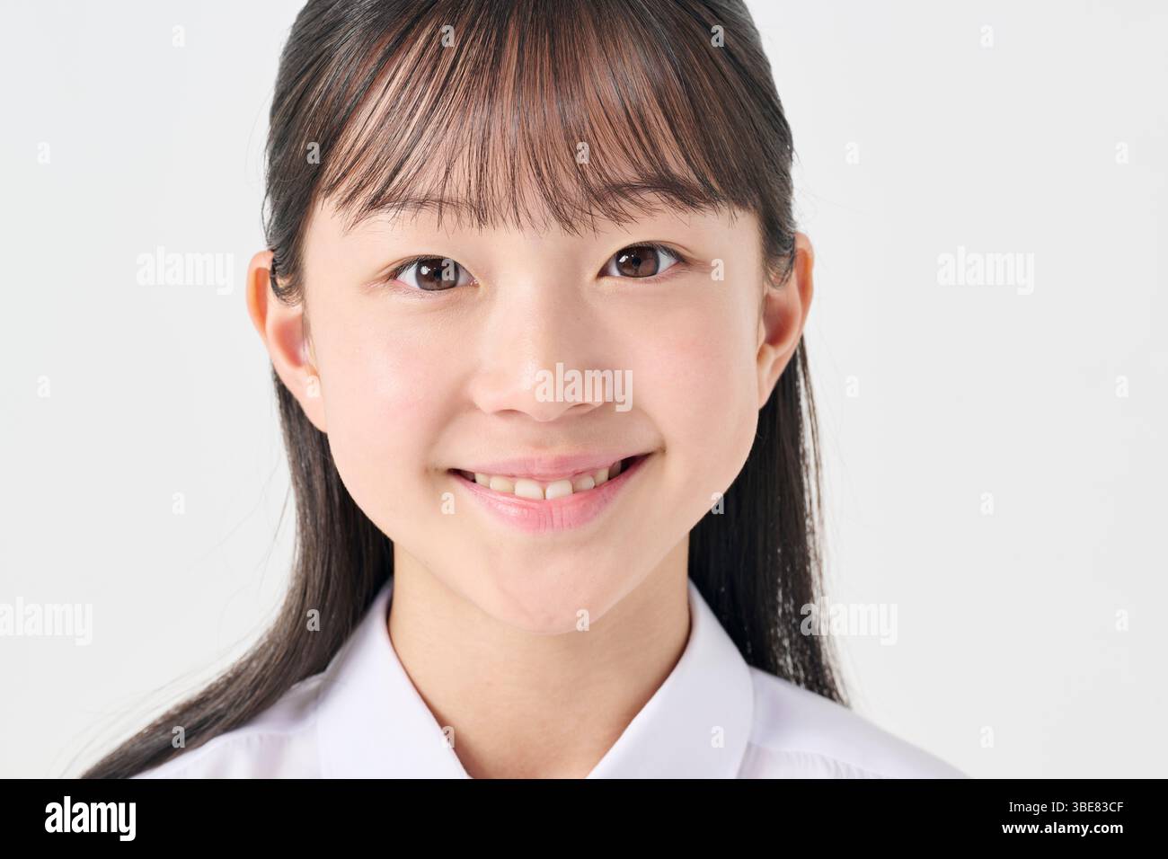 Japanese Junior High School Girl Against White Background, Smiling ...
