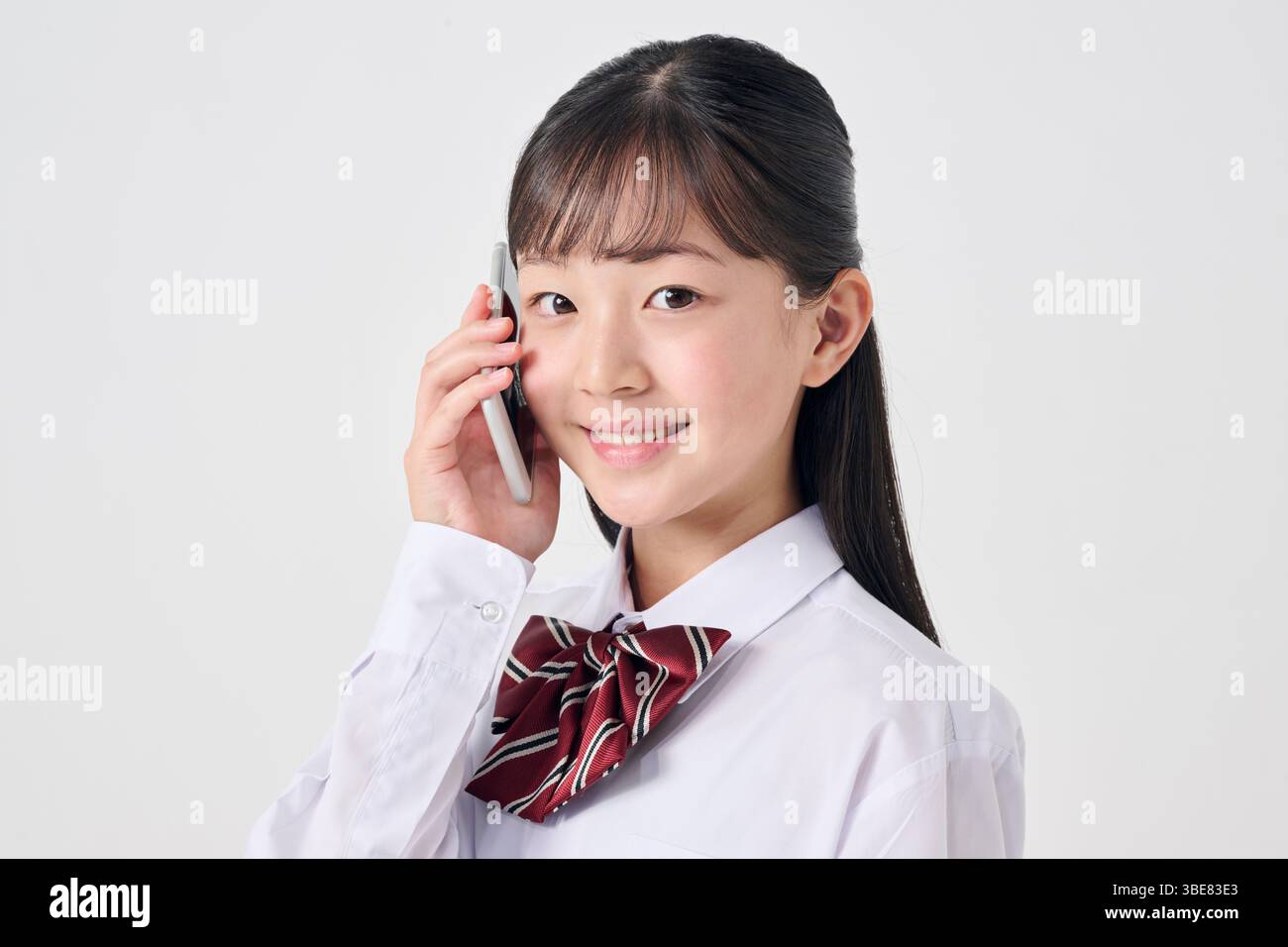 Japanese Junior High School Girl on White Background, Making a Phone ...