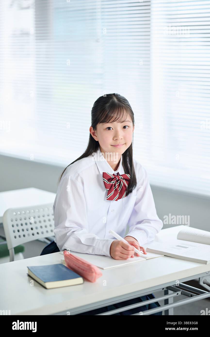 Junior high school girls taking a class in a classroom Stock Photo - Alamy