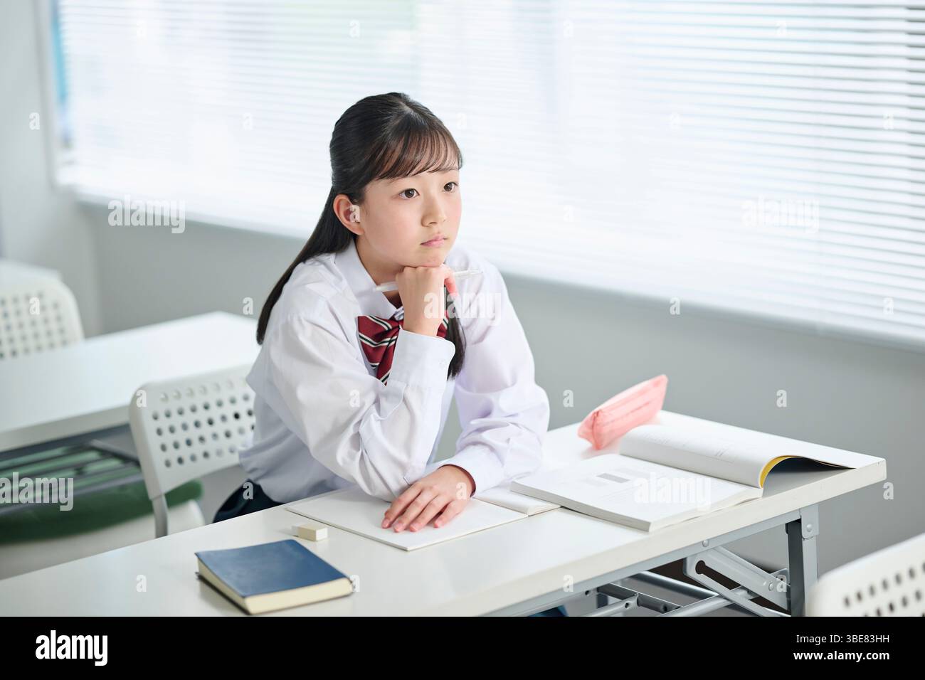 Junior high school girls taking a class in a classroom Stock Photo - Alamy