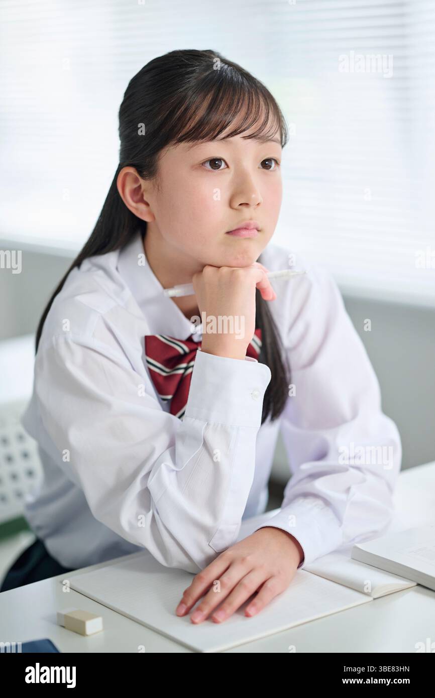 Junior high school girls taking a class in a classroom Stock Photo - Alamy