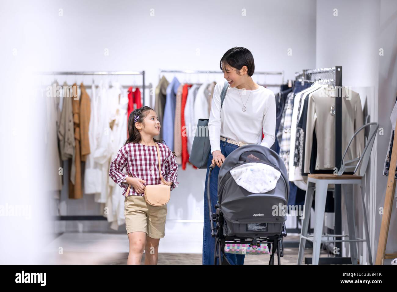 Boy pushing pushchair hi-res stock photography and images - Alamy