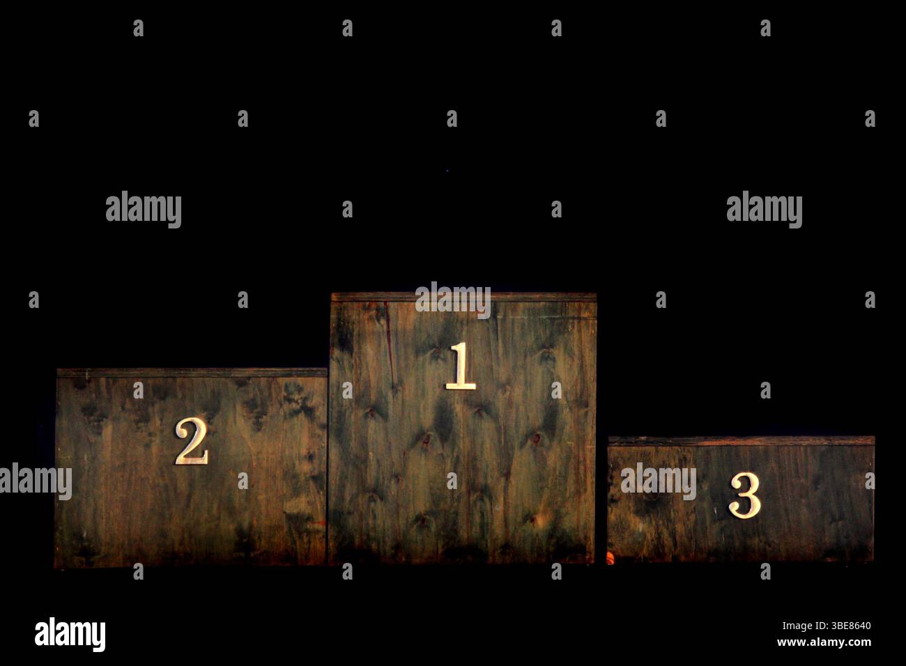 wooden winner stage on the black background Stock Photo - Alamy