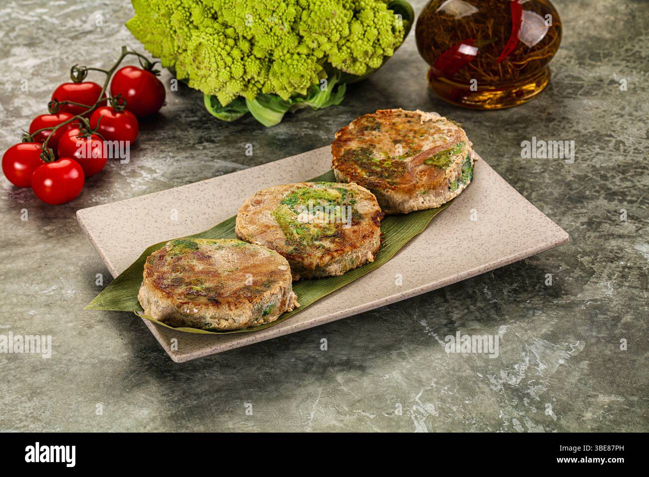 Roasted tuna medallion with broccoli cabbage Stock Photo - Alamy