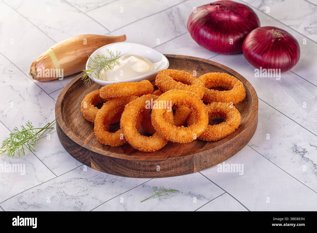 Golden fried breaded onion rings snack Stock Photo - Alamy