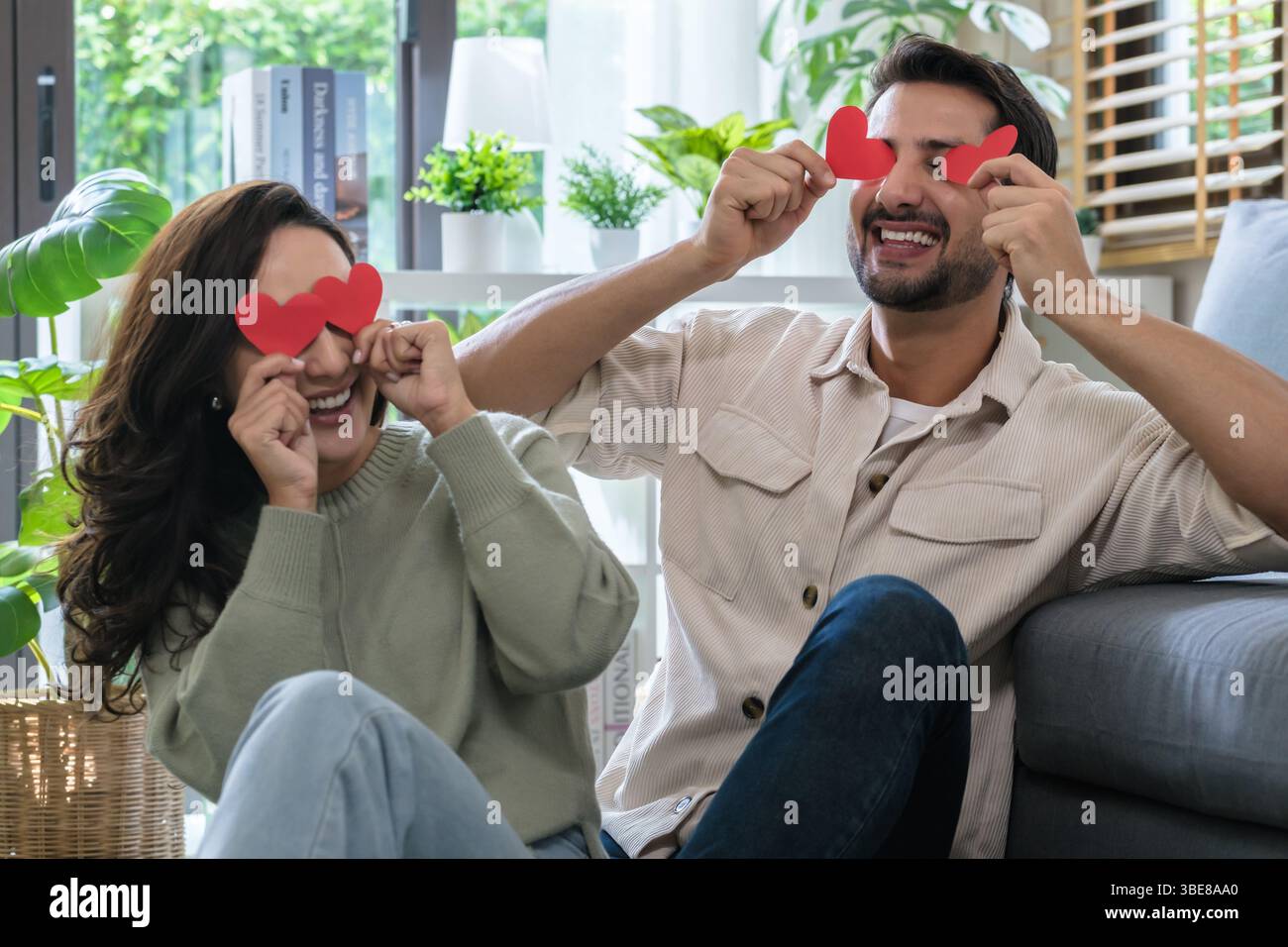 Cheerful hispanic couple having fun together on Valentine’s Day ...