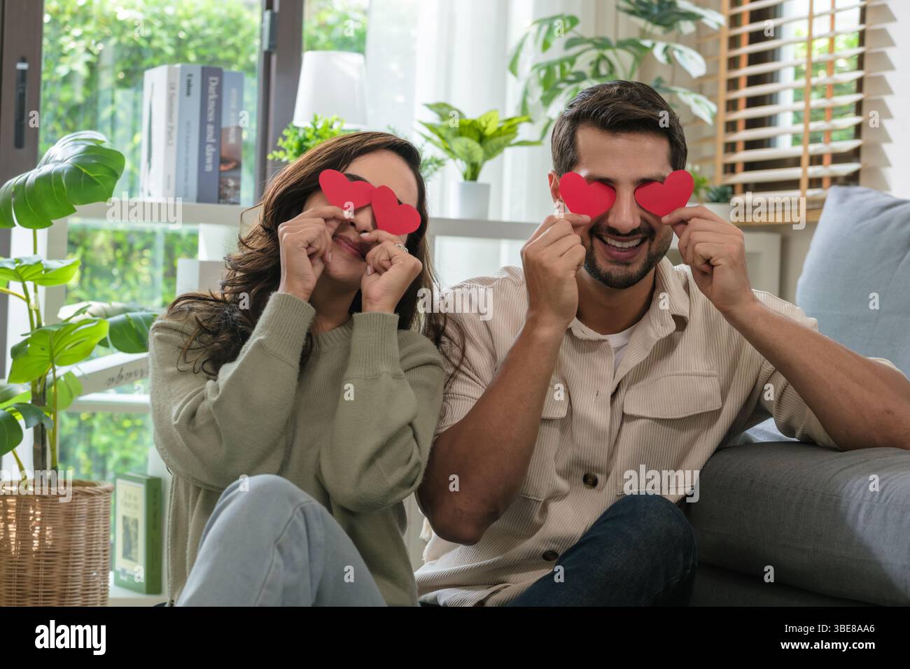 Cheerful hispanic couple having fun together on Valentine’s Day ...