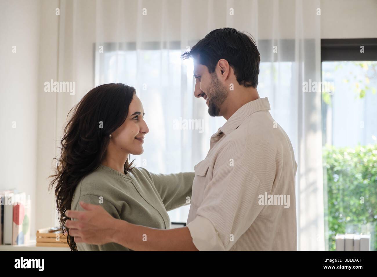 Happy couple dancing at home in joyful movement and playful emotion ...
