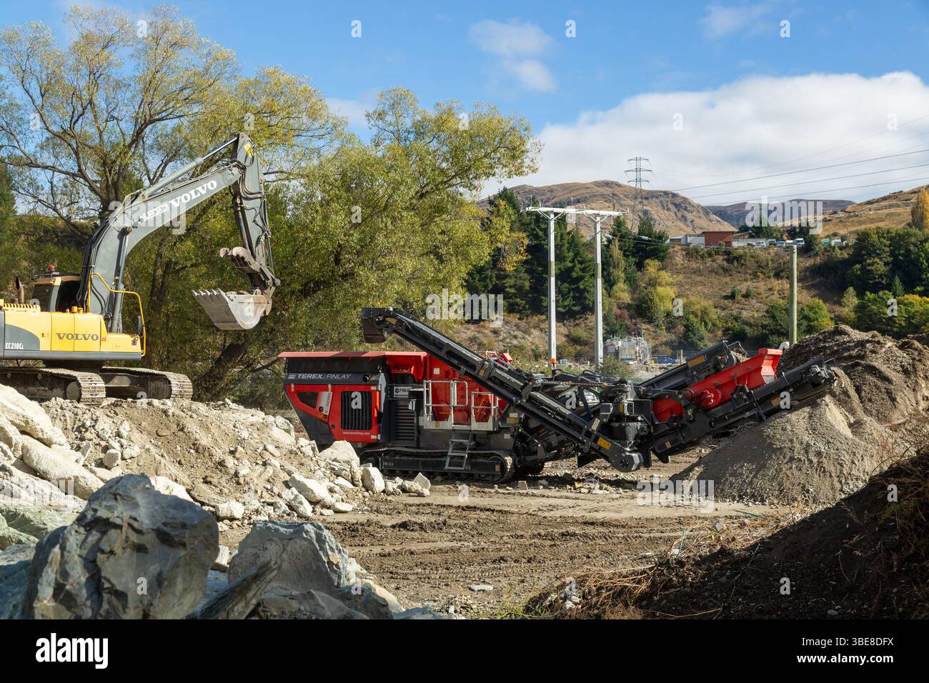 A impact crusher in action, crushing large chunks of rock into smaller ...