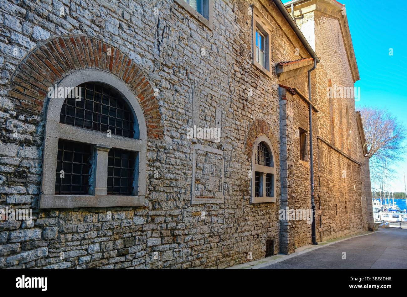 Arched windows in side of the Pula Cathedral, Croatia. The windows have ...