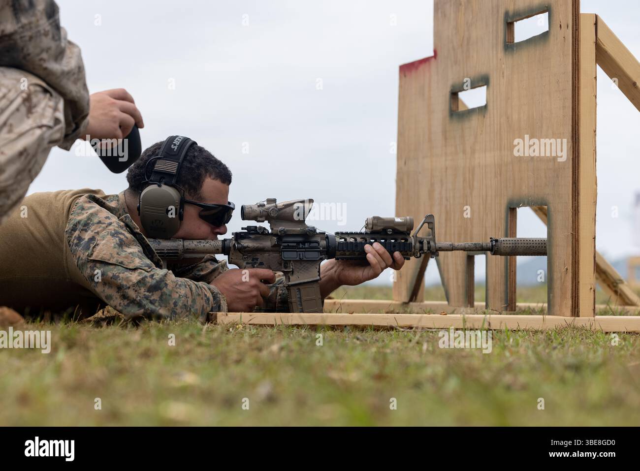 U.S. Marine Corps Cpl. Jason Young fires an M27 Infantry Automatic ...