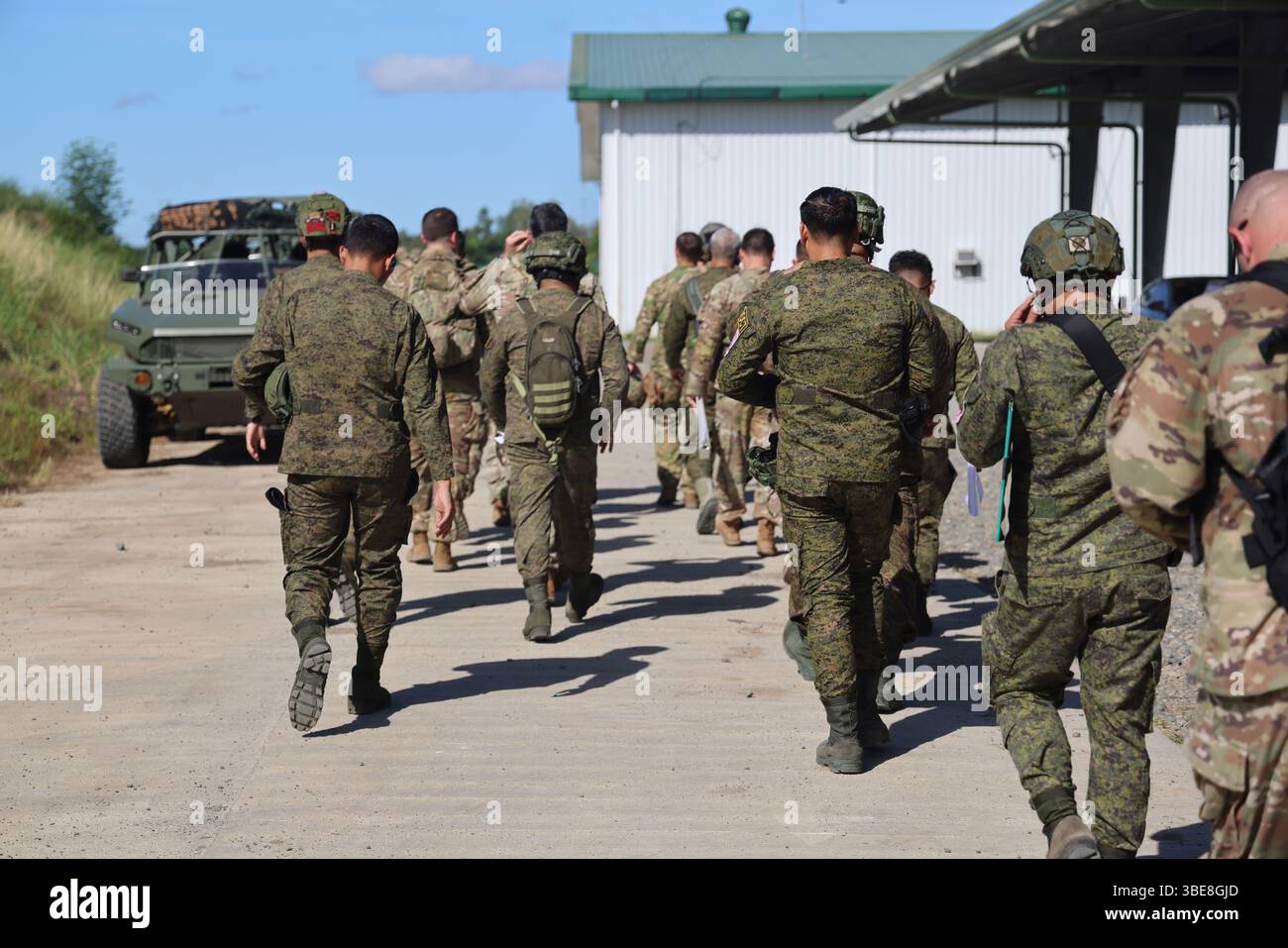 Philippine and U.S. Army leaders walk toward a Black Hawk helicopter at ...