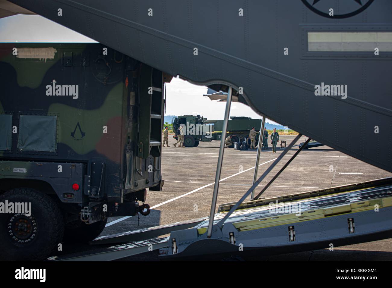 U.S. Army Soldiers and U.S. Air Force Airmen position a High Mobility ...