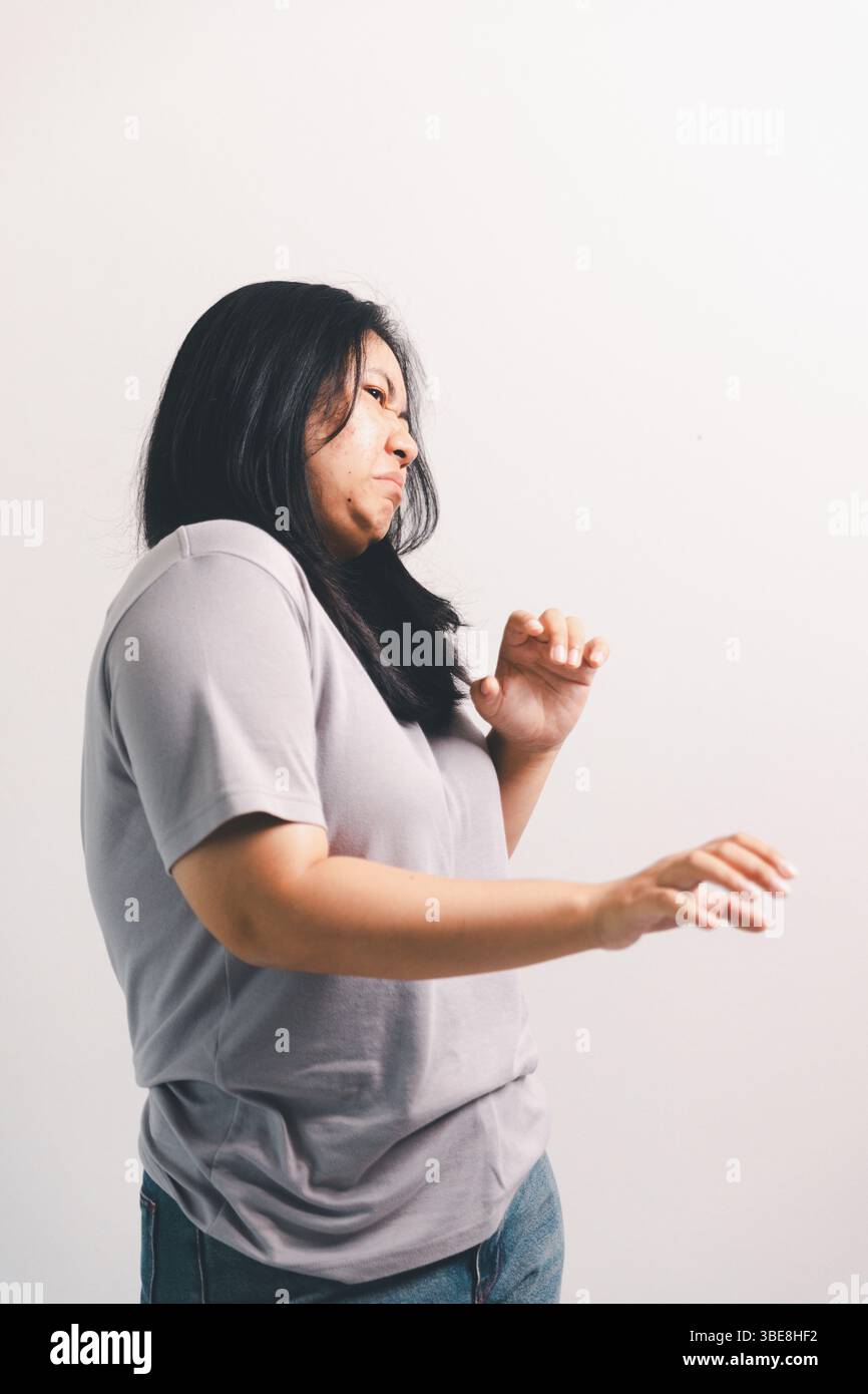 Asian girl expresses dislike, person express negative feeling, concept ...