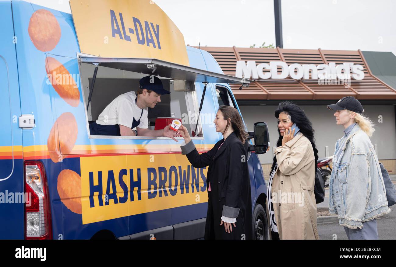 EDITORIAL USE ONLY Customers queue at Aldi???s new Hash Brown Van ...