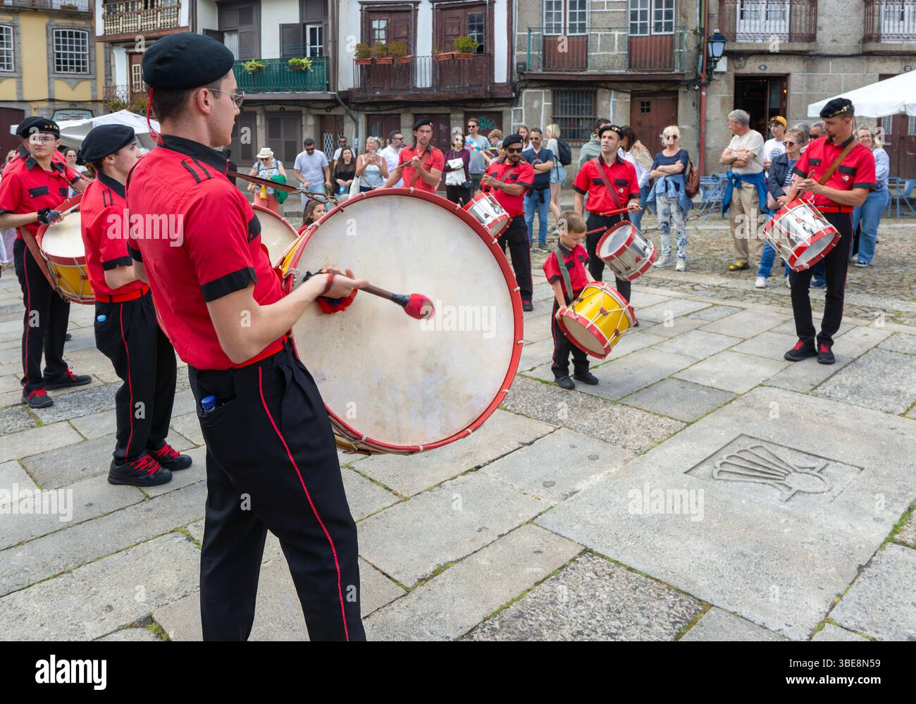 Traditional drum and pipe band perform on city streets on May Day 2025 ...
