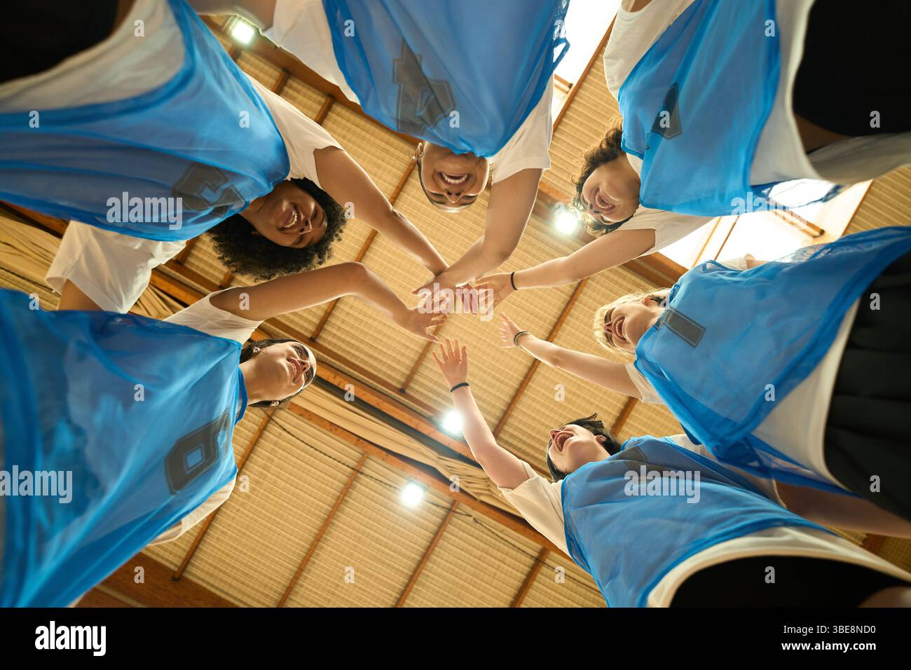 Happy athletes joining hands before hi-res stock photography and images ...
