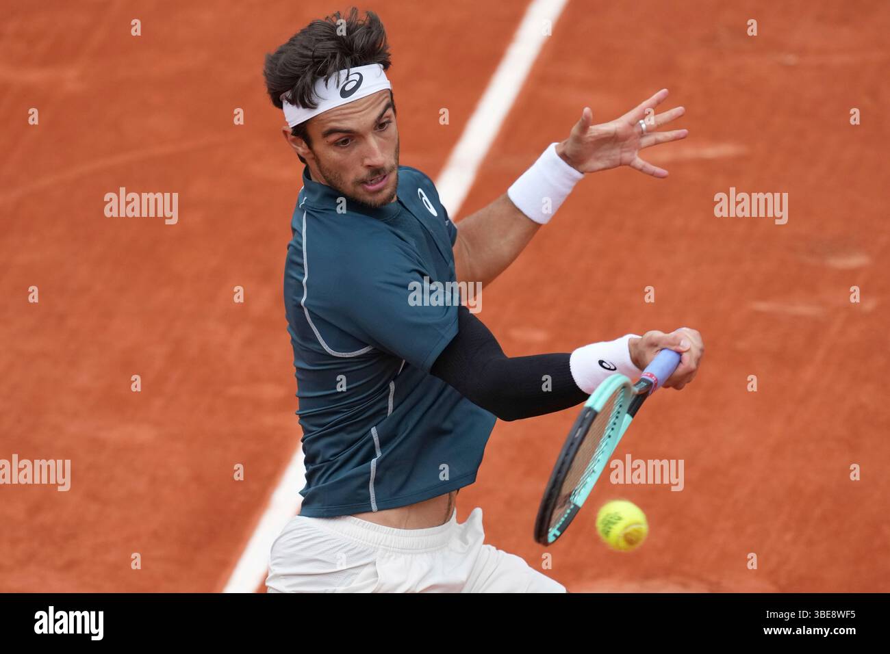 Italy's Lorenzo Musetti hits a forehand against Colombia's Daniel Elahi Galan during their ...