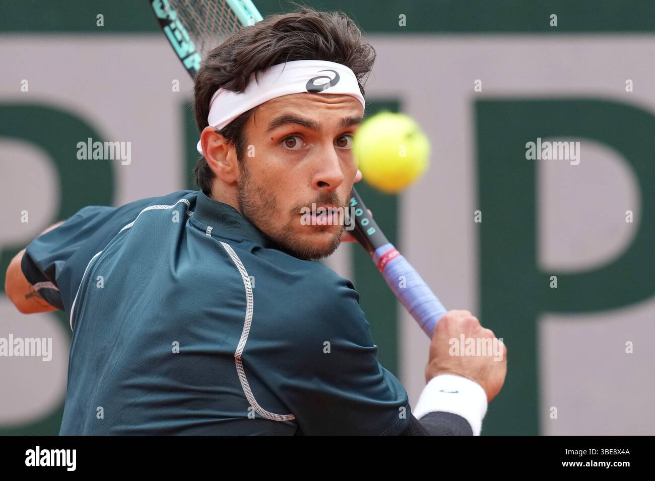 Italy's Lorenzo Musetti eyes the ball as he plays Colombia's Daniel Elahi Galan during their ...