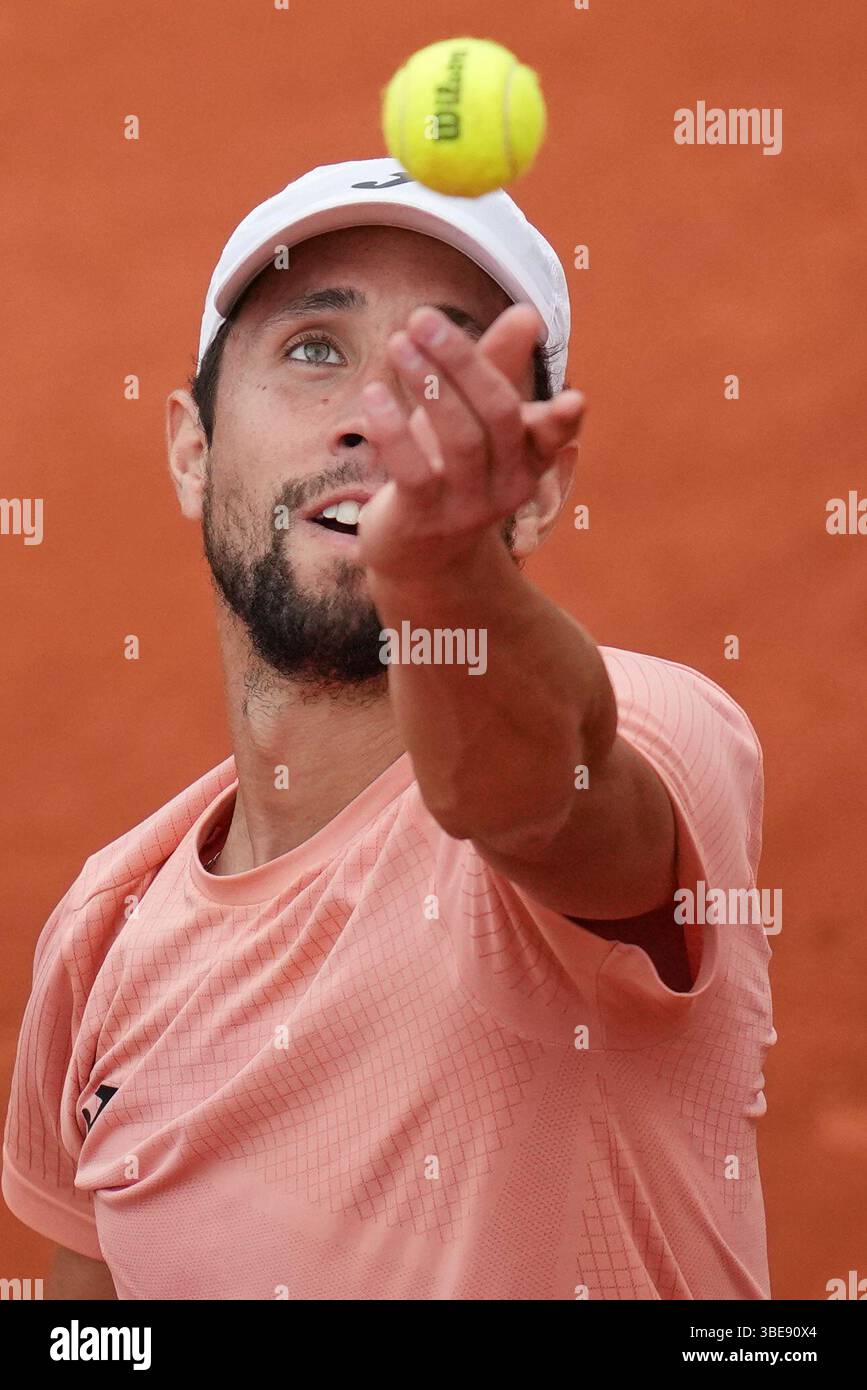 Colombia's Daniel Elahi Galan serves against Italy's Lorenzo Musetti during their second round ...