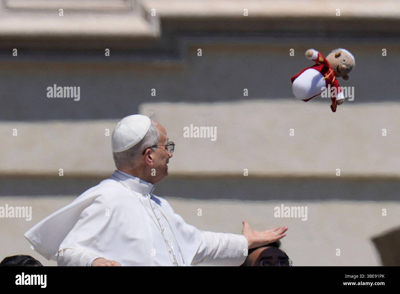 Pope Leo XIV catches a little doll representing the Pope while leaving ...