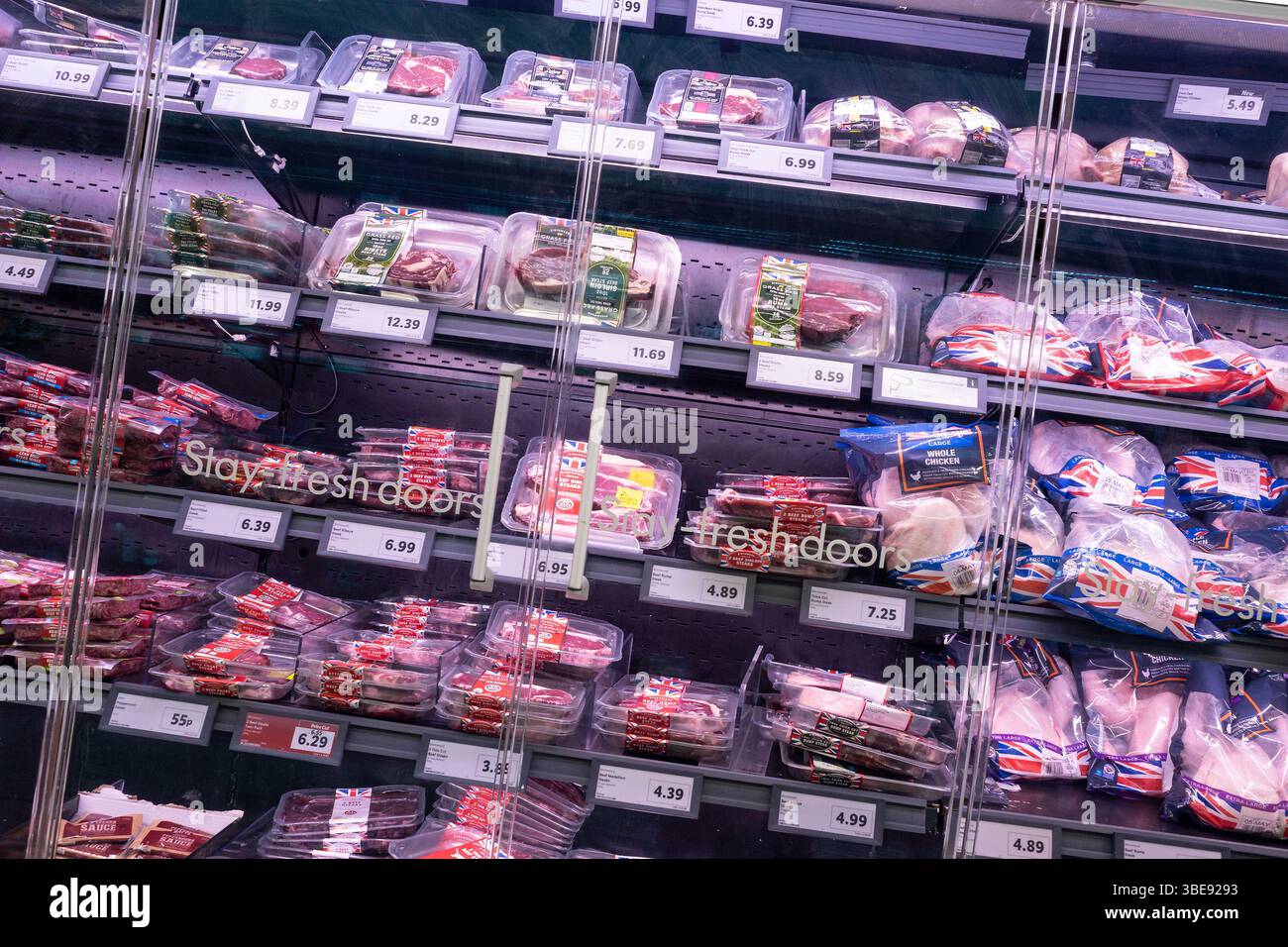 Packaged meat on sale display inside a Lidl supermarket in the UK in ...