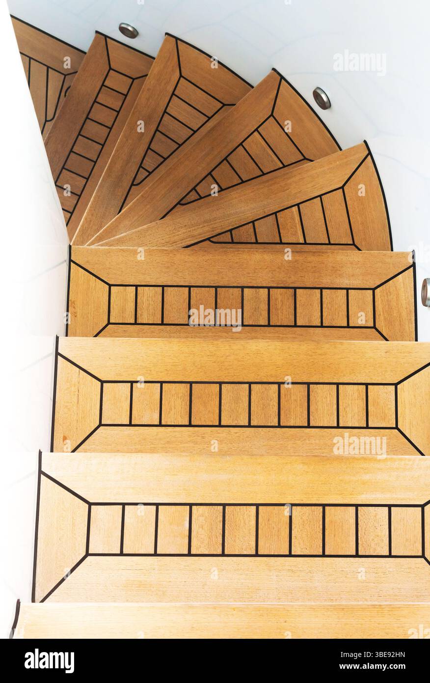 Spiral teak steps inside a luxury yacht Stock Photo - Alamy