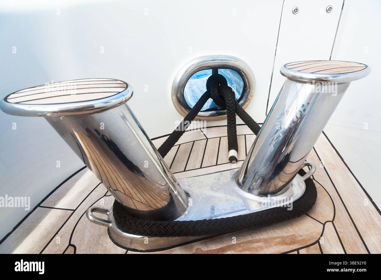 Mooring hawse on a yacht with a rope, which is fixed on the bollard ...