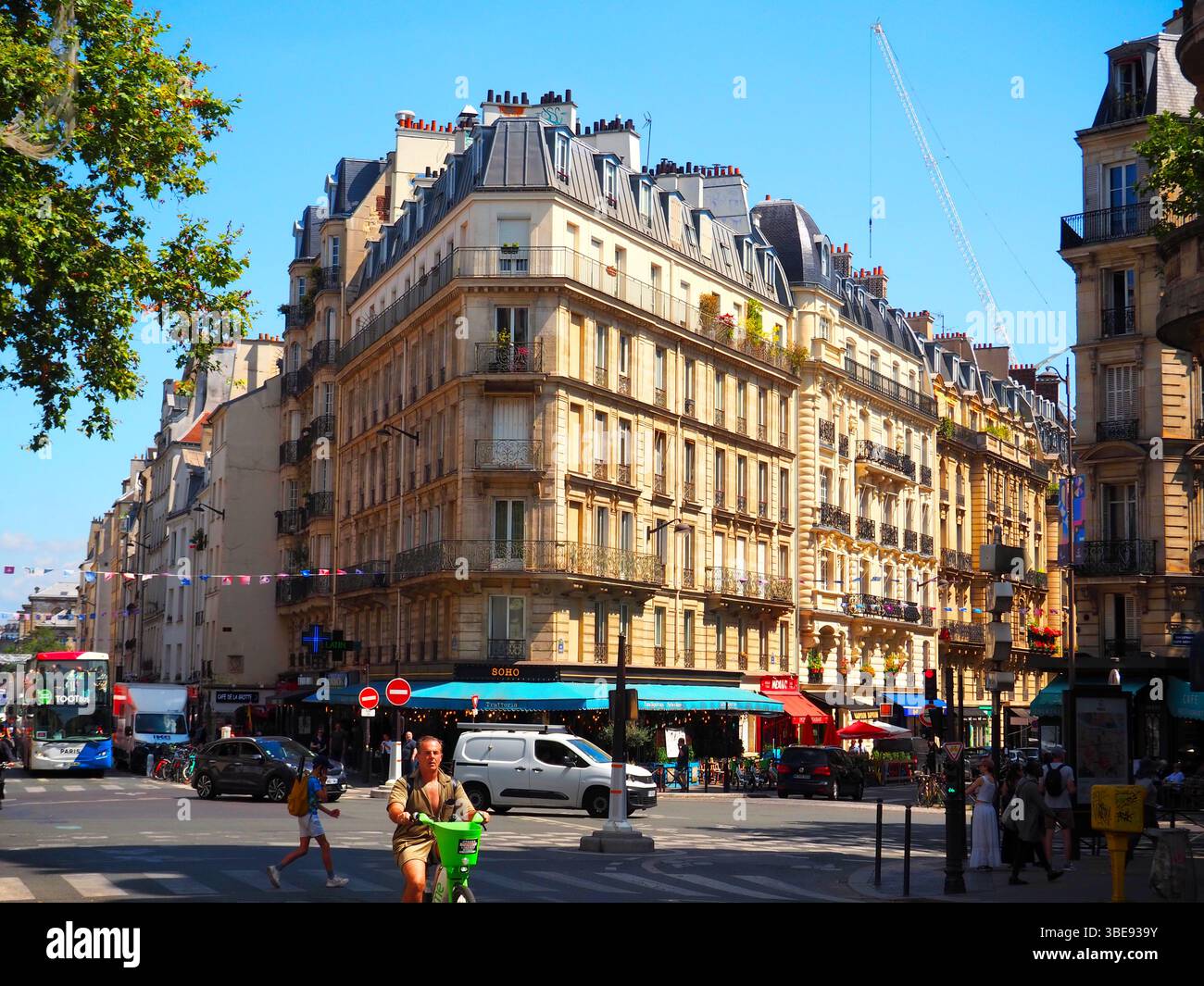 Classic Haussmann architecture in Paris with Olympic decorations on a ...